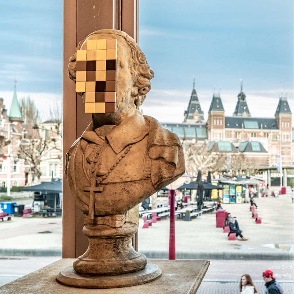 Pixelated face of Cardinal Sin – Travel with Intent
